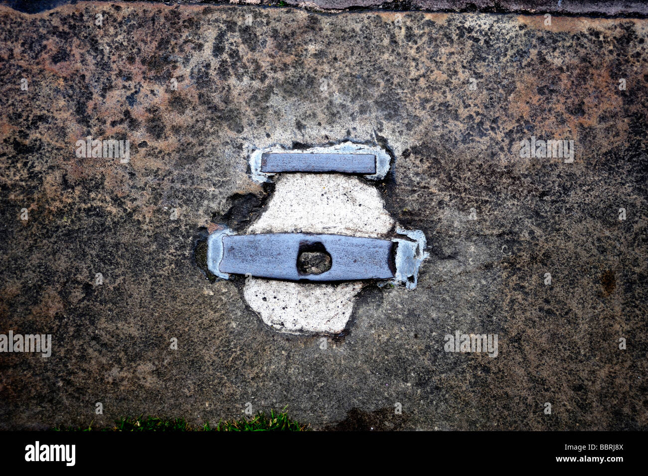 Metal embedded in stone Stock Photo - Alamy
