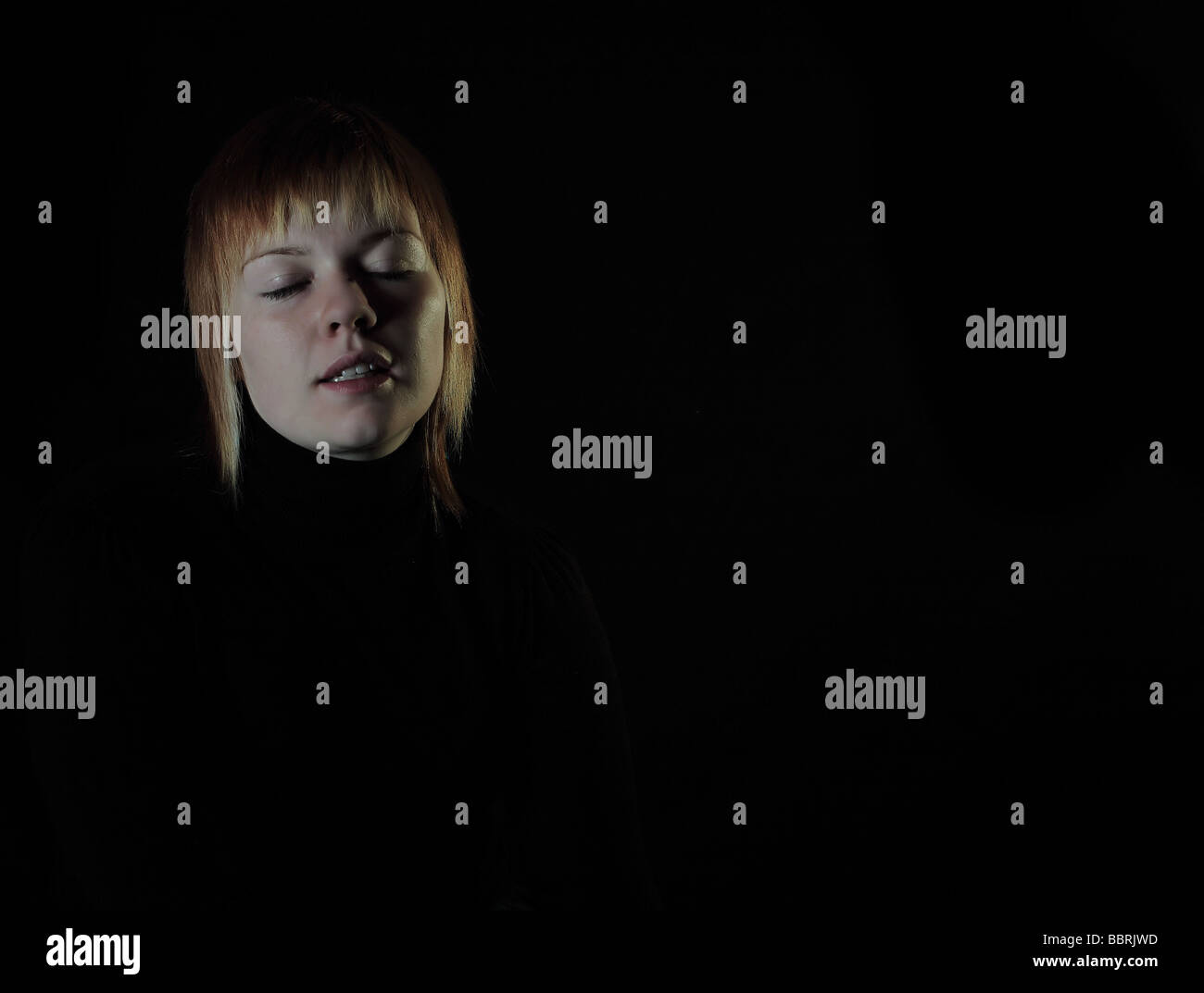 Female model on dark background Stock Photo - Alamy