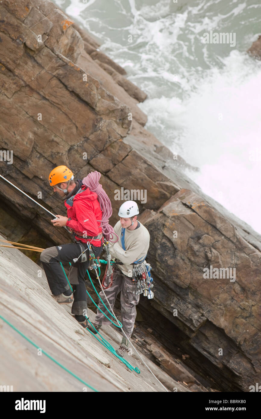 Climbers on a sea cliff climb on Baggy Point near Croyde in north Devon ...