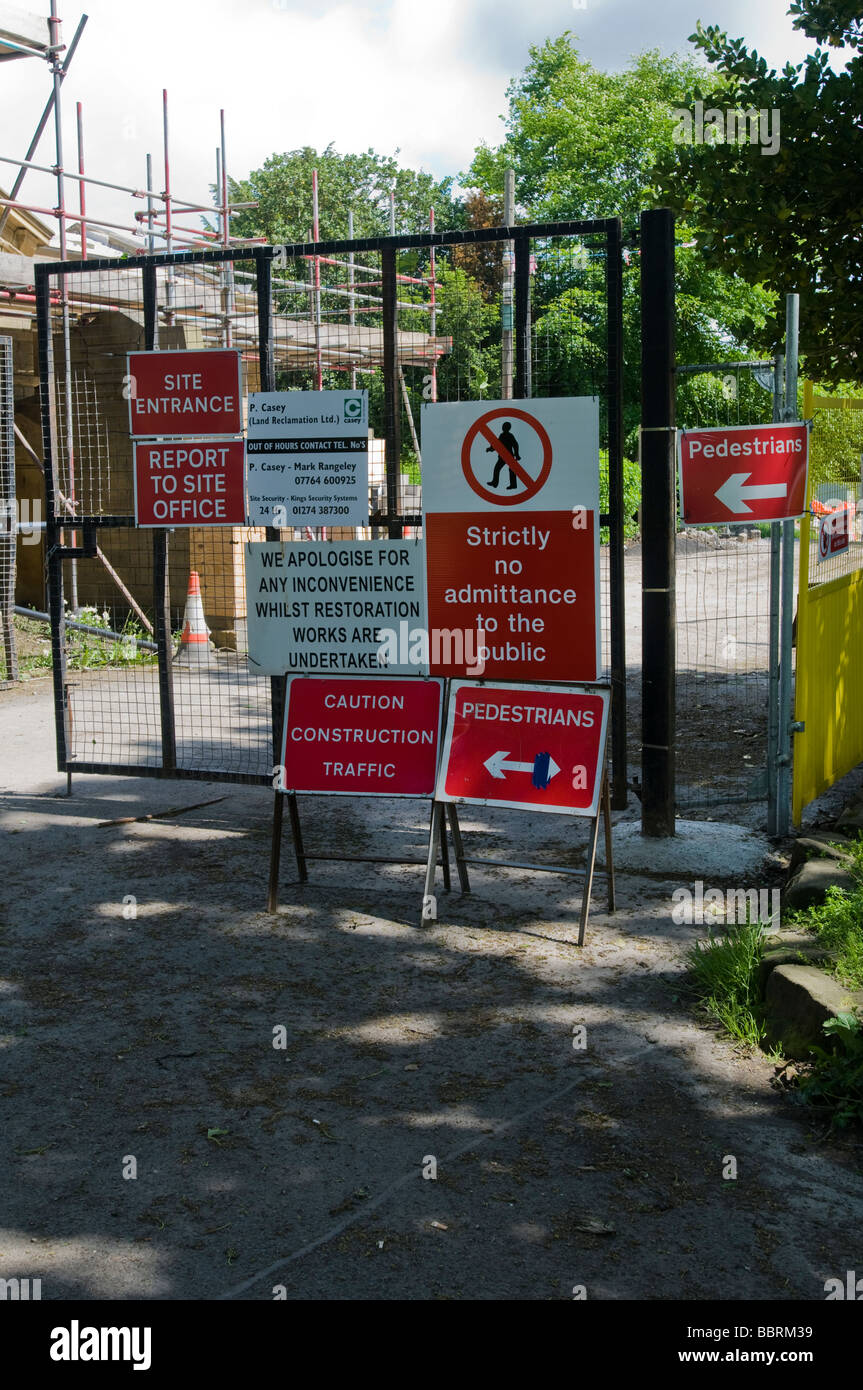 Warning signs outside a building site, Roberts Park, Saltaire, West ...