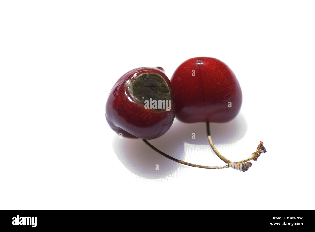 rotten cherry close to fresh cherry Stock Photo - Alamy