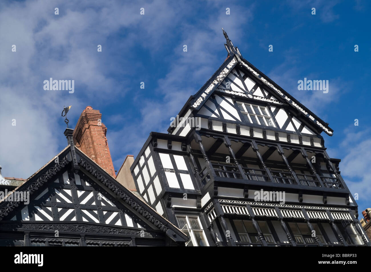 Tudor style building detail against a blue sky Stock Photo - Alamy