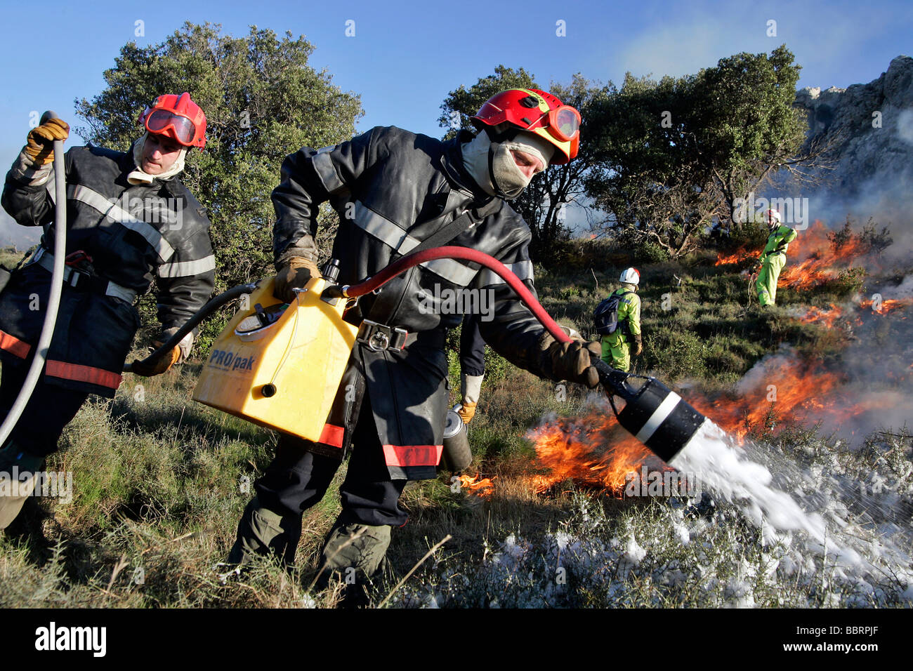 Fireman beating fire hi-res stock photography and images - Alamy