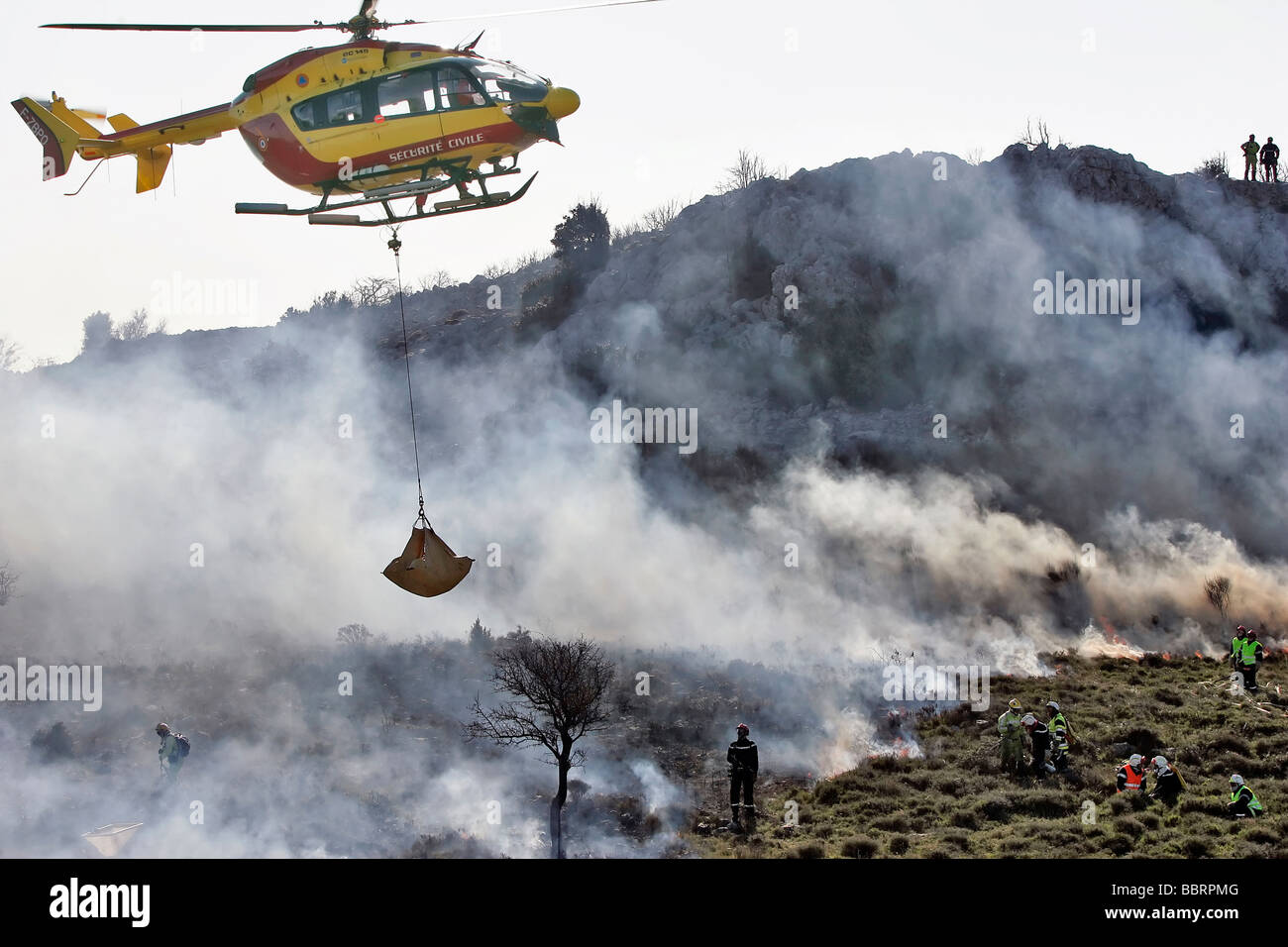 Fireman beating fire hi-res stock photography and images - Alamy