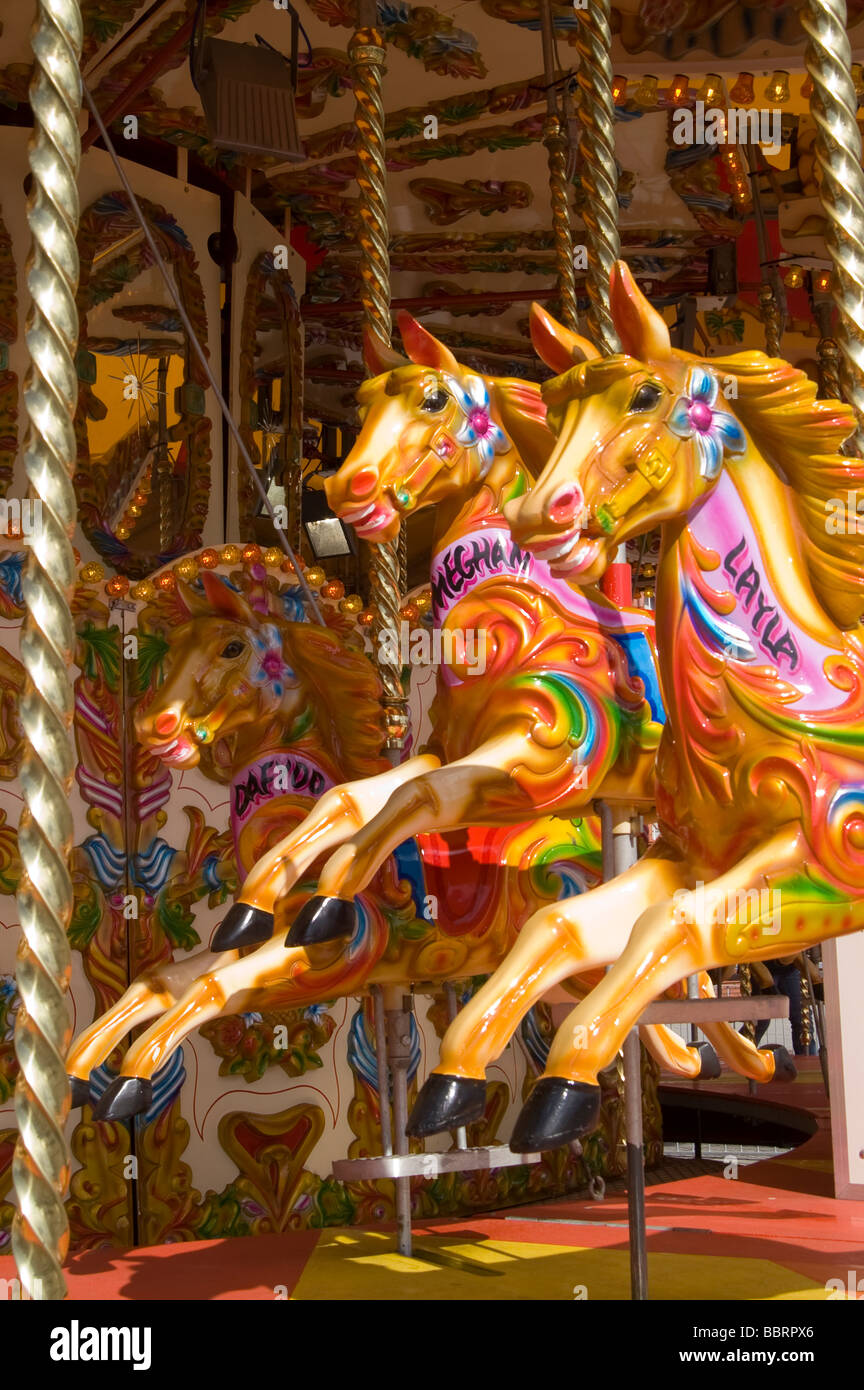 Merry go round with colourful horses Stock Photo - Alamy