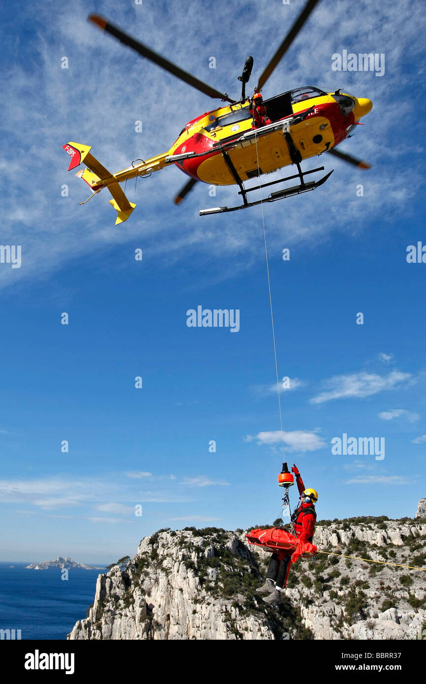 Helicopter winching hi-res stock photography and images - Alamy