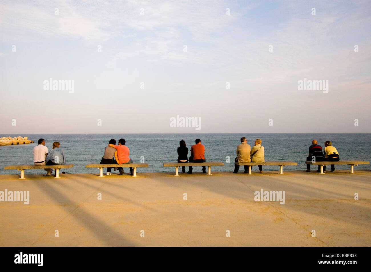 Five couples look at the beach Stock Photo - Alamy