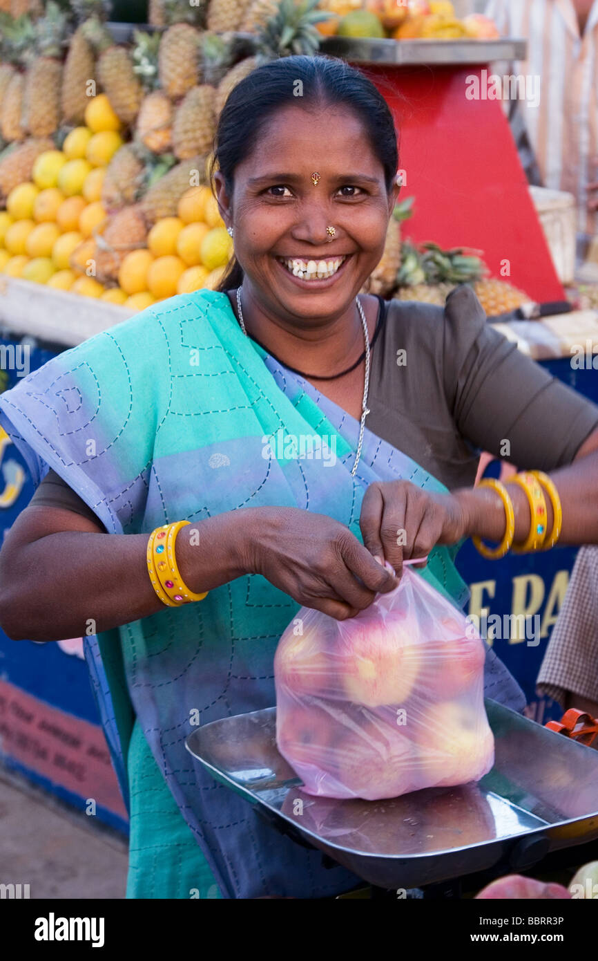 Indian Woman Fruit-Seller Ties Fruits into a Plastic Bag. Bhuj, Kutch ...