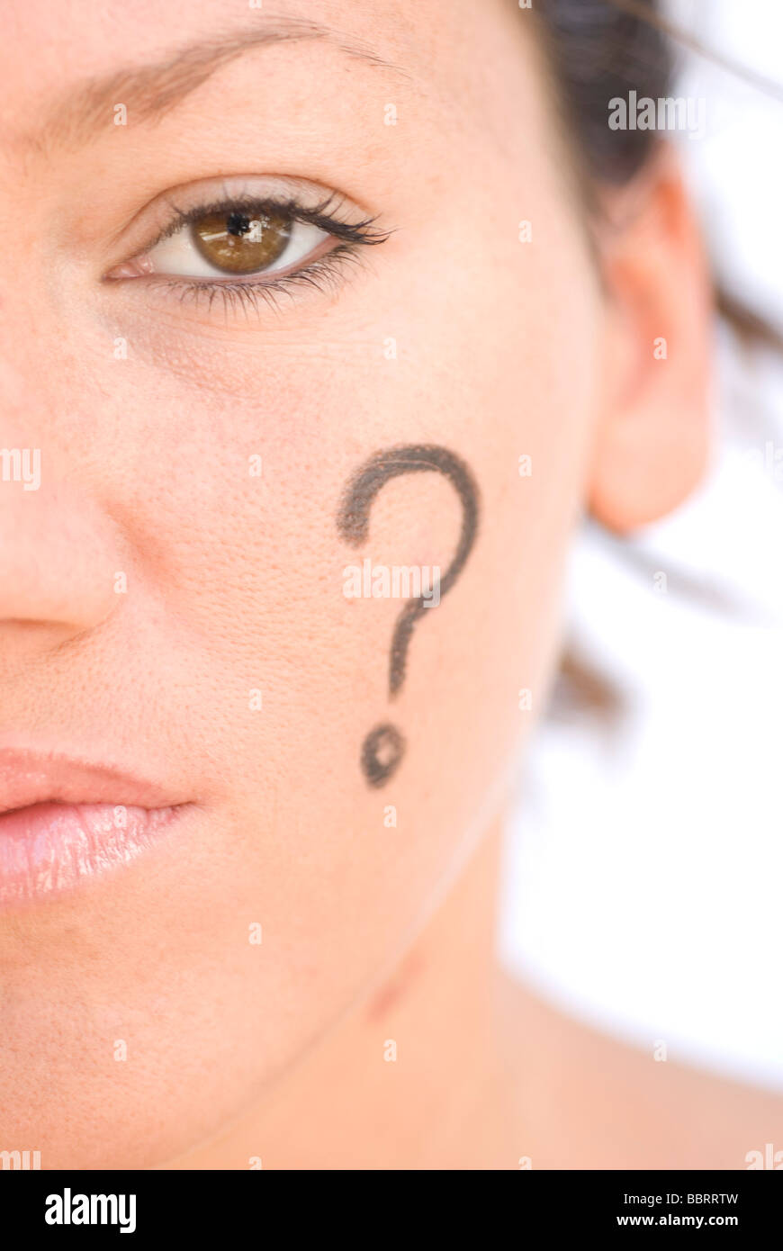 Question mark simbol painted in woman´s face and thinking on answer ...