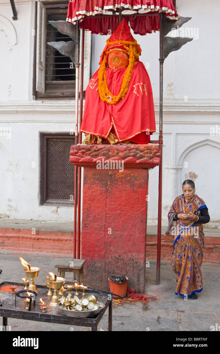 Kathmandu, Nepal. Hanuman Statue and Worshiper at the Entrance to the ...