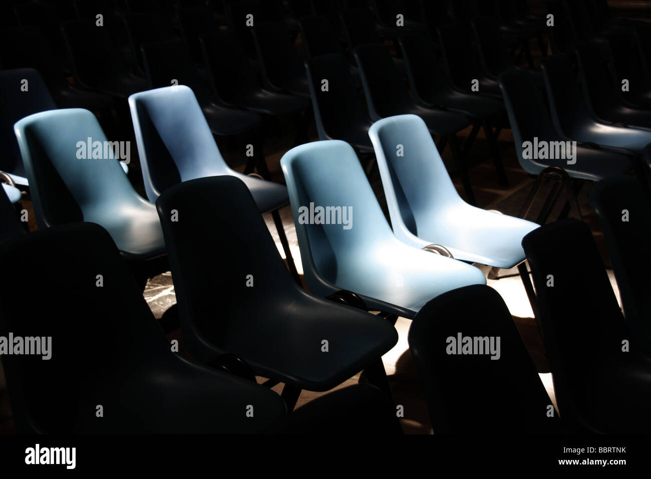 rows of empty plastic chairs in church in rome italy Stock Photo - Alamy