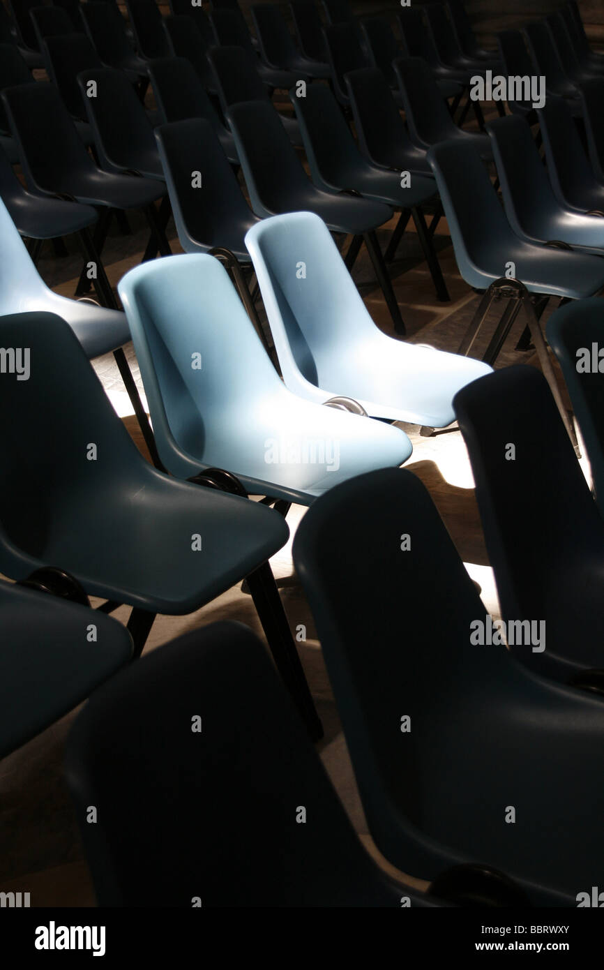 rows of empty plastic chairs in church in rome italy Stock Photo - Alamy