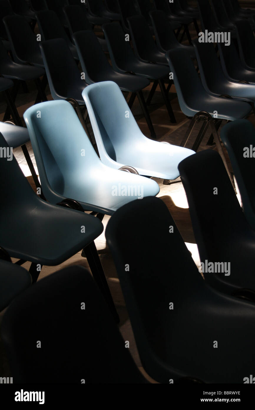 rows of empty plastic chairs in church in rome italy Stock Photo - Alamy