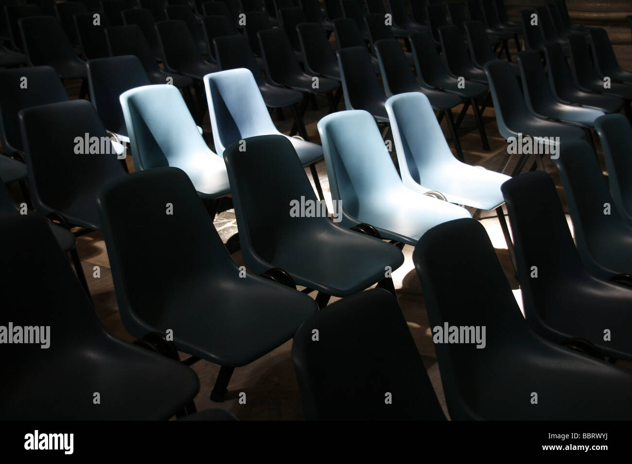 rows of empty plastic chairs in church in rome italy Stock Photo - Alamy