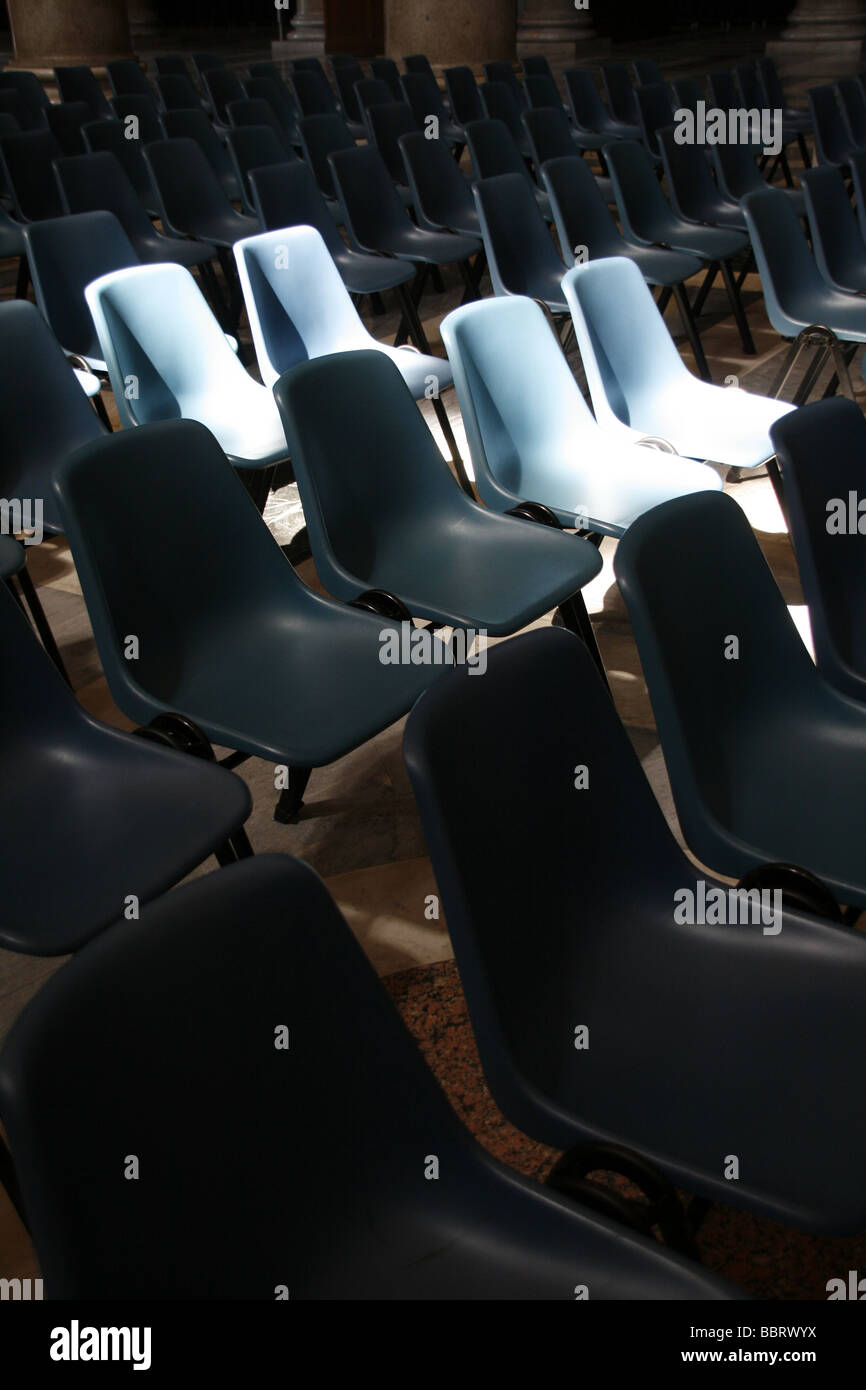 rows of empty plastic chairs in church in rome italy Stock Photo - Alamy