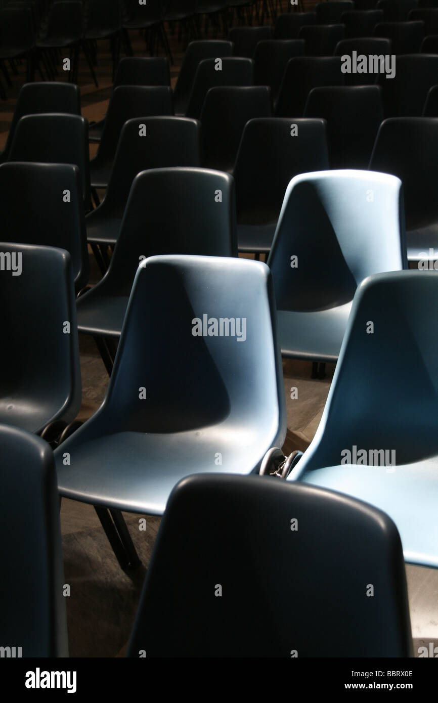 rows of empty plastic chairs in church in rome italy Stock Photo - Alamy