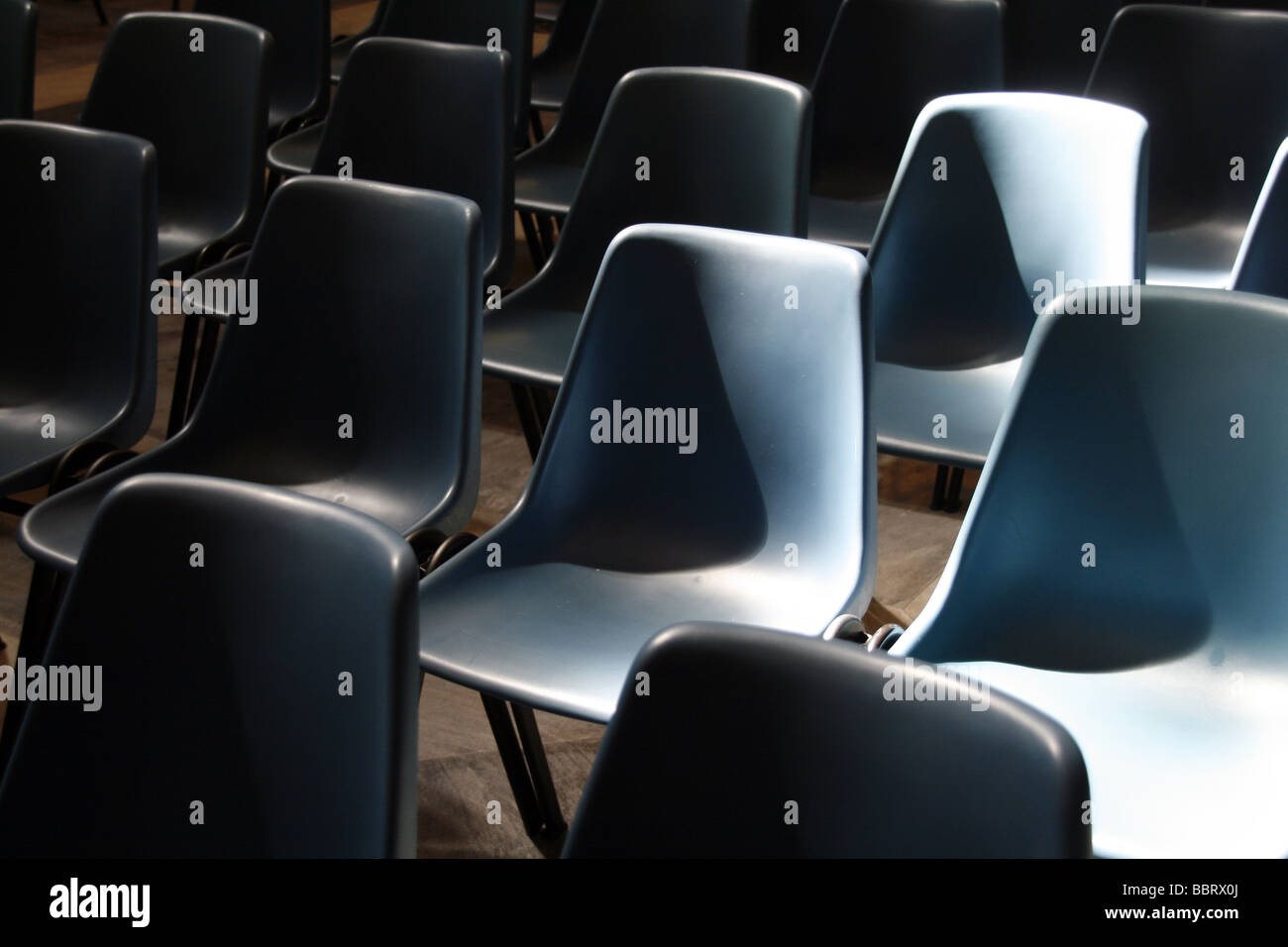 rows of empty plastic chairs in church in rome italy Stock Photo - Alamy