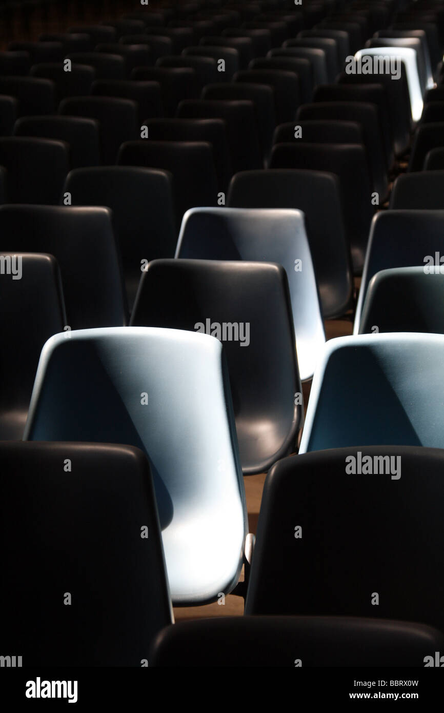 rows of empty plastic chairs in church in rome italy Stock Photo - Alamy
