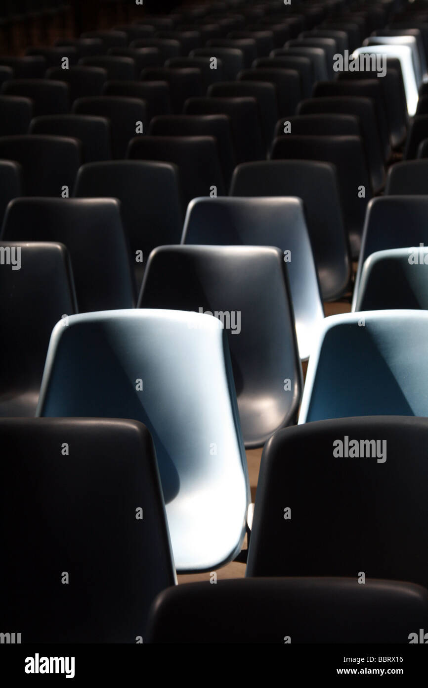 rows of empty plastic chairs in church in rome italy Stock Photo - Alamy