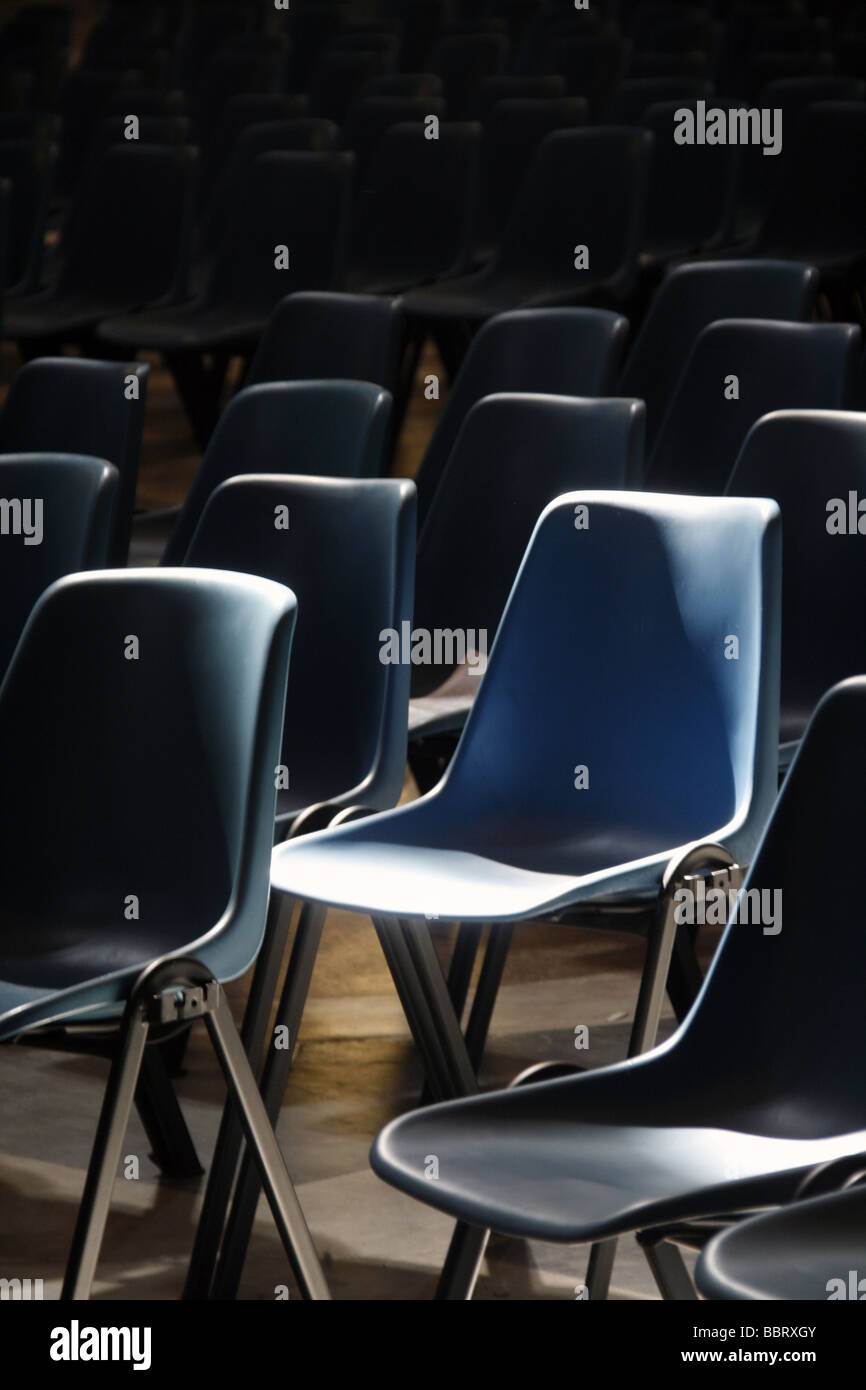 rows of empty plastic chairs in church in rome italy Stock Photo - Alamy