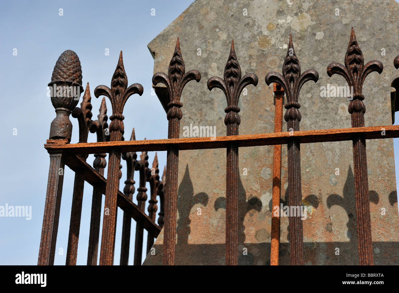 Rusty, ornamental iron railings, churchyard. Ruined Church of Saint ...