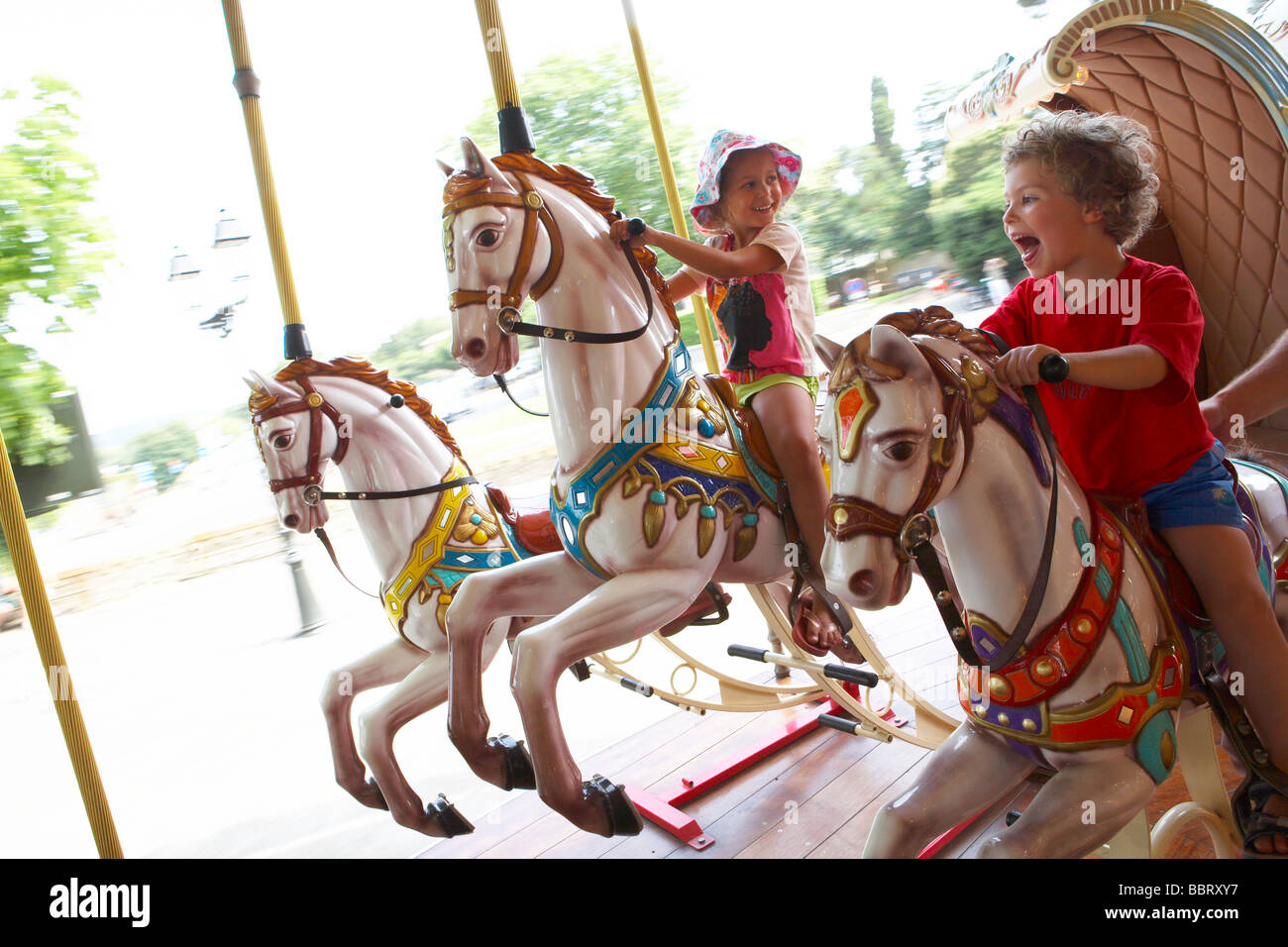 Children fairground carousel horses hi-res stock photography and images ...