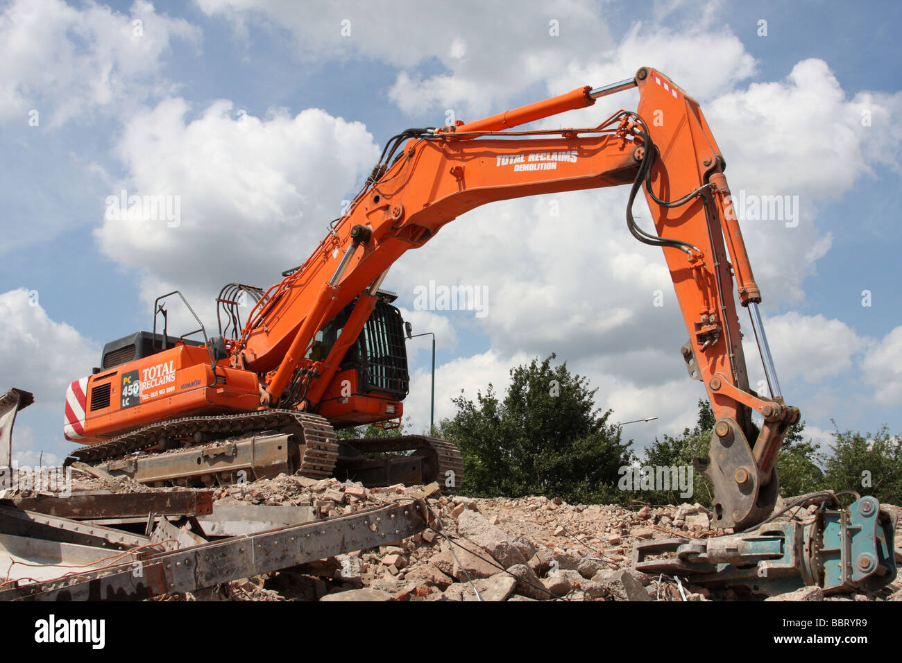 An earthmover on a demolition site in a U.K. city Stock Photo - Alamy