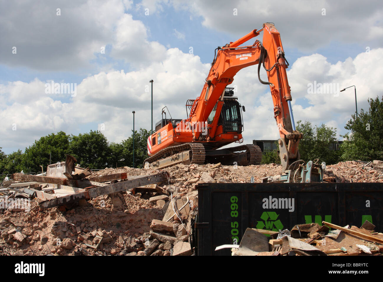 An earthmover on a demolition site in a U.K. city Stock Photo - Alamy