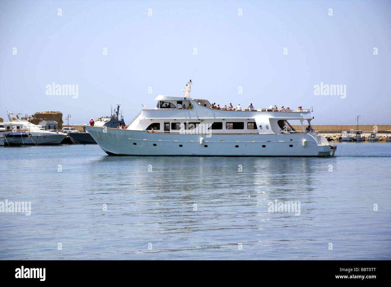 Tourist boat leaving Paphos Harbour in Cyprus Stock Photo - Alamy