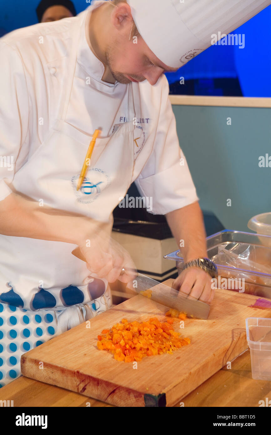 Chefs chops carrot Stock Photo - Alamy