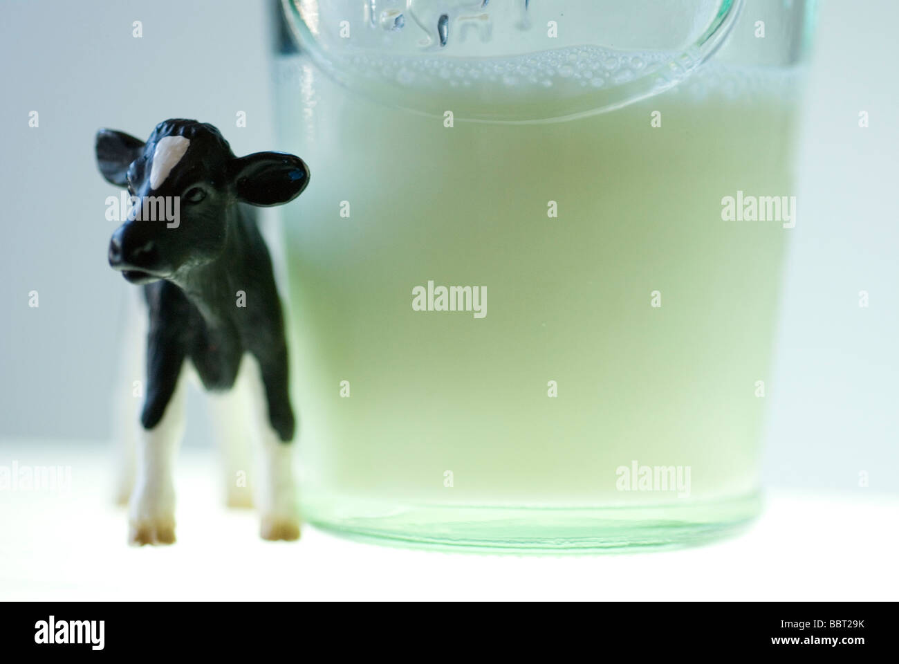 baby veal toy and a glass of milk Stock Photo - Alamy