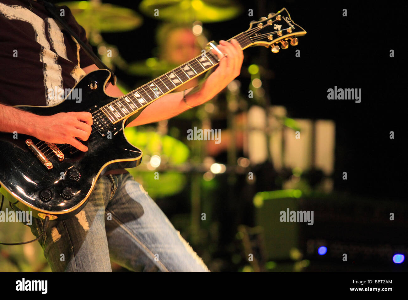 rock musicians playing at a live concert Stock Photo - Alamy