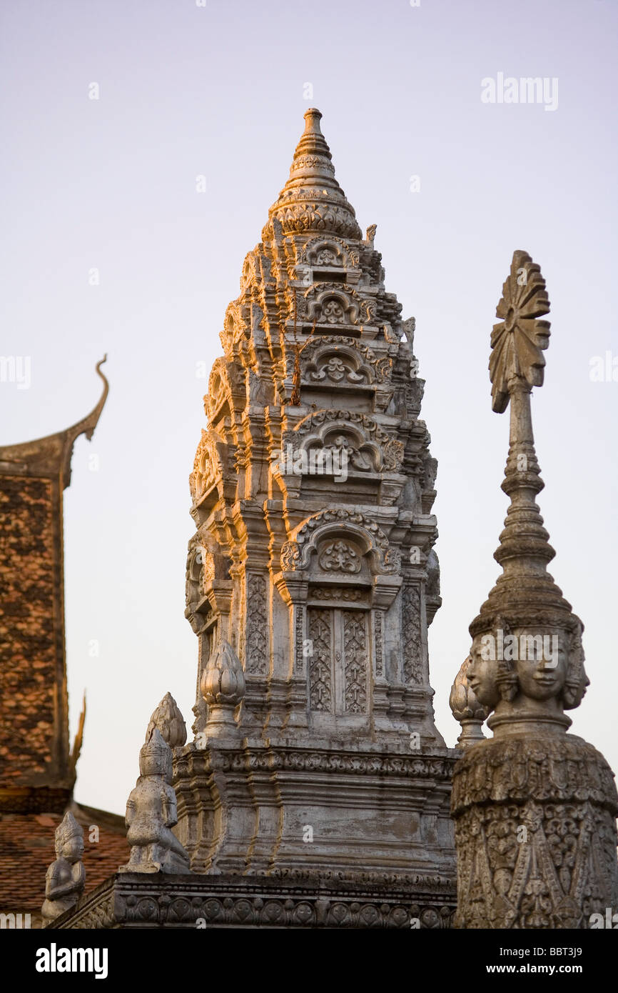 Buddhist stupas and temple roof at sunset - Phnom Penh, Cambodia Stock ...