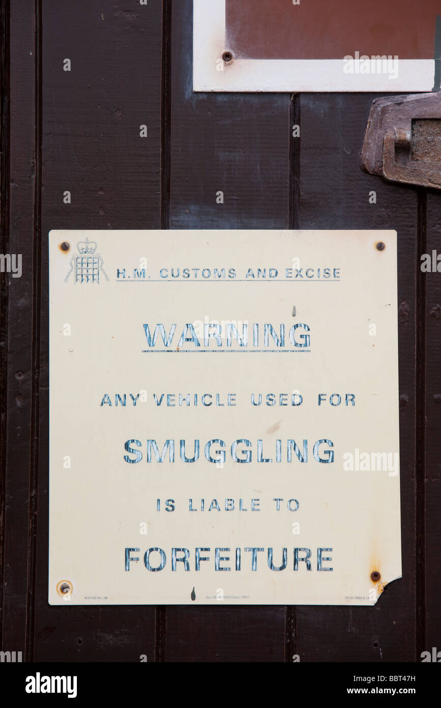 A warning sign to smugglers in Porlock Weir Somerset UK Stock Photo - Alamy