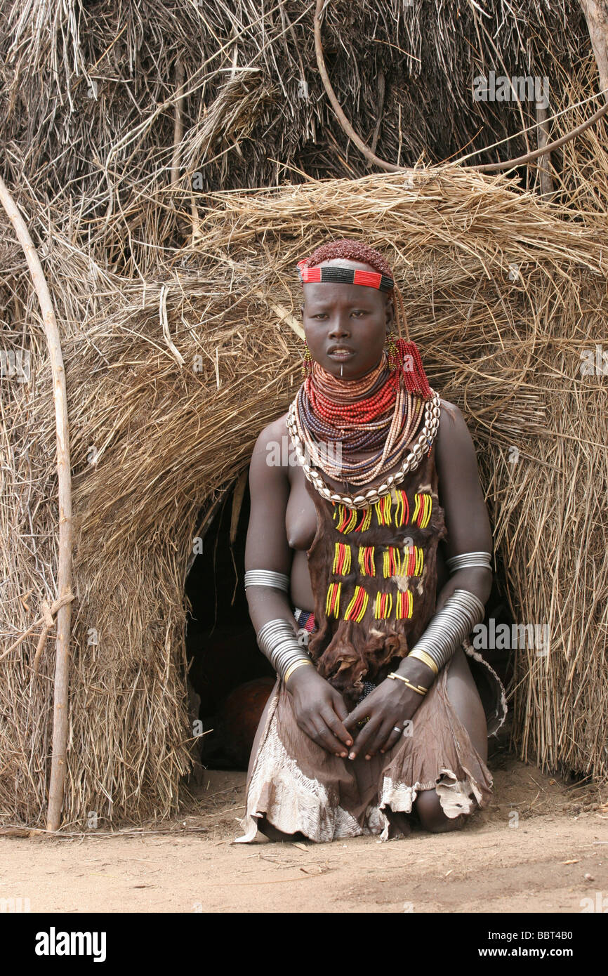 Africa Ethiopia Omo Valley Daasanach Tribe Woman In Front Of Hut Stock