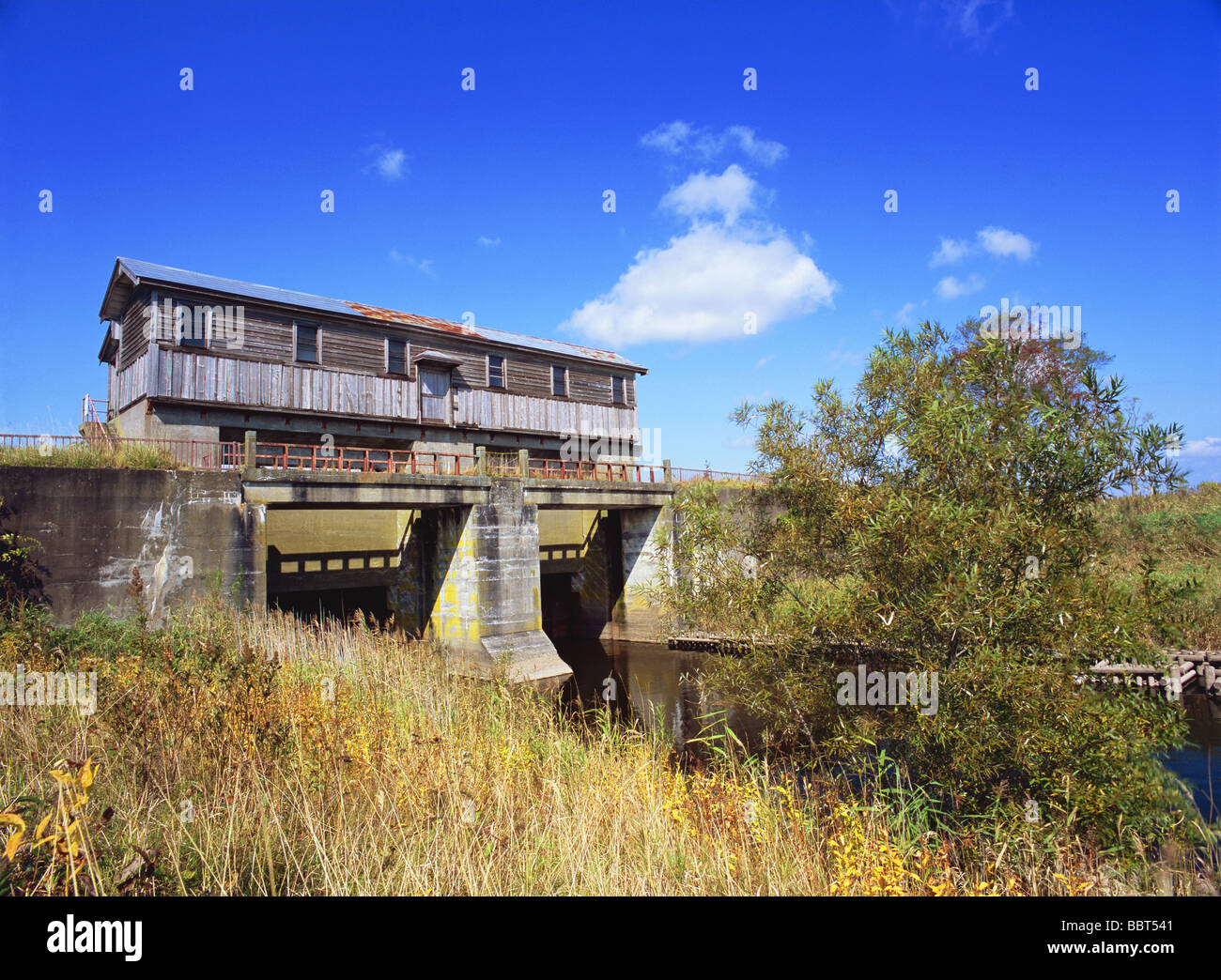 Rustic wooden house with bridge in countryside Stock Photo - Alamy
