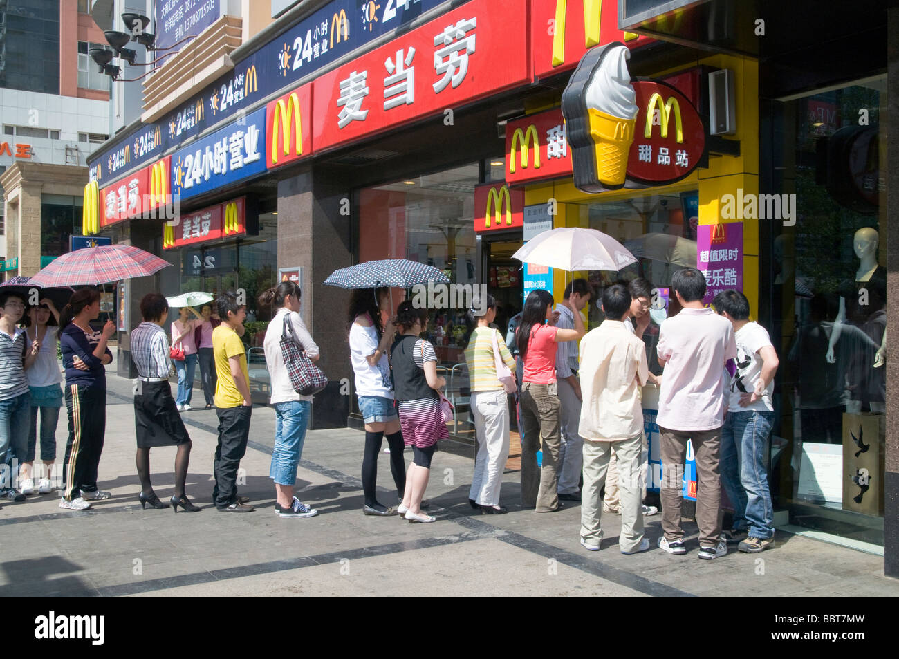 CHINA Local people waiting outside a Mac Donald's fast food restaurant ...