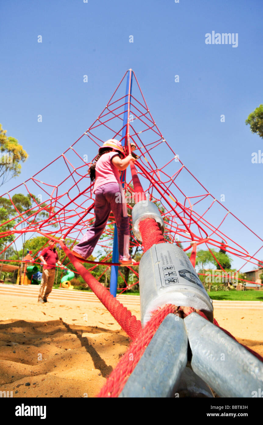 Israel Negev desert Omer A child of 4 climbing a rope net in a ...