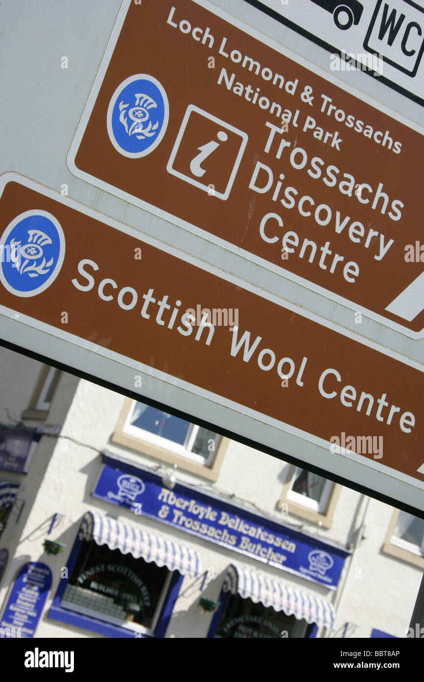 Village of Aberfoyle, Scotland. Tourist direction signs on Main Street ...