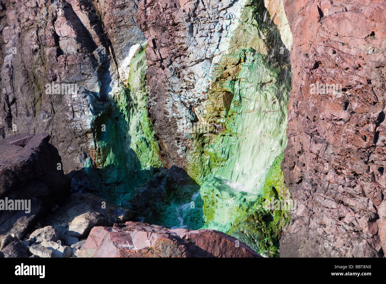 Sea Cliffs stained green from copper deposits leaching from the old ...