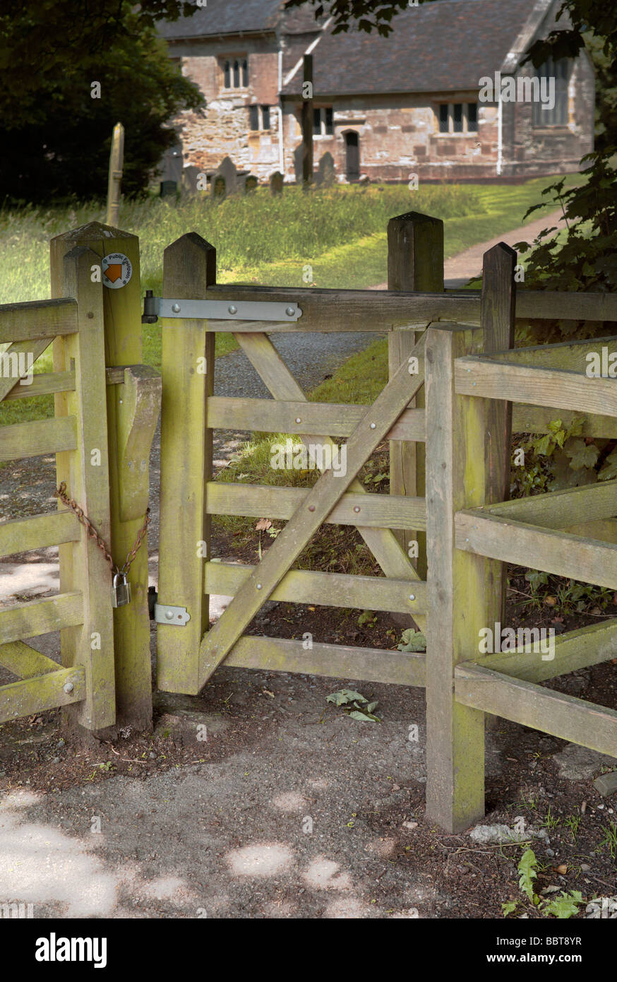 A gate on a footpath leading to a church Stock Photo - Alamy