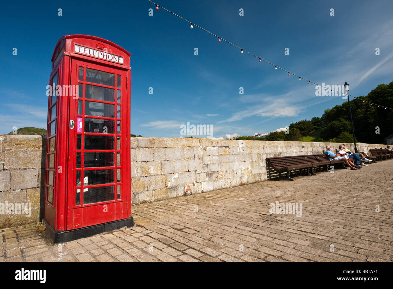Red British Telephone Box in Ilfracombe Harbour, Devon, England Stock ...