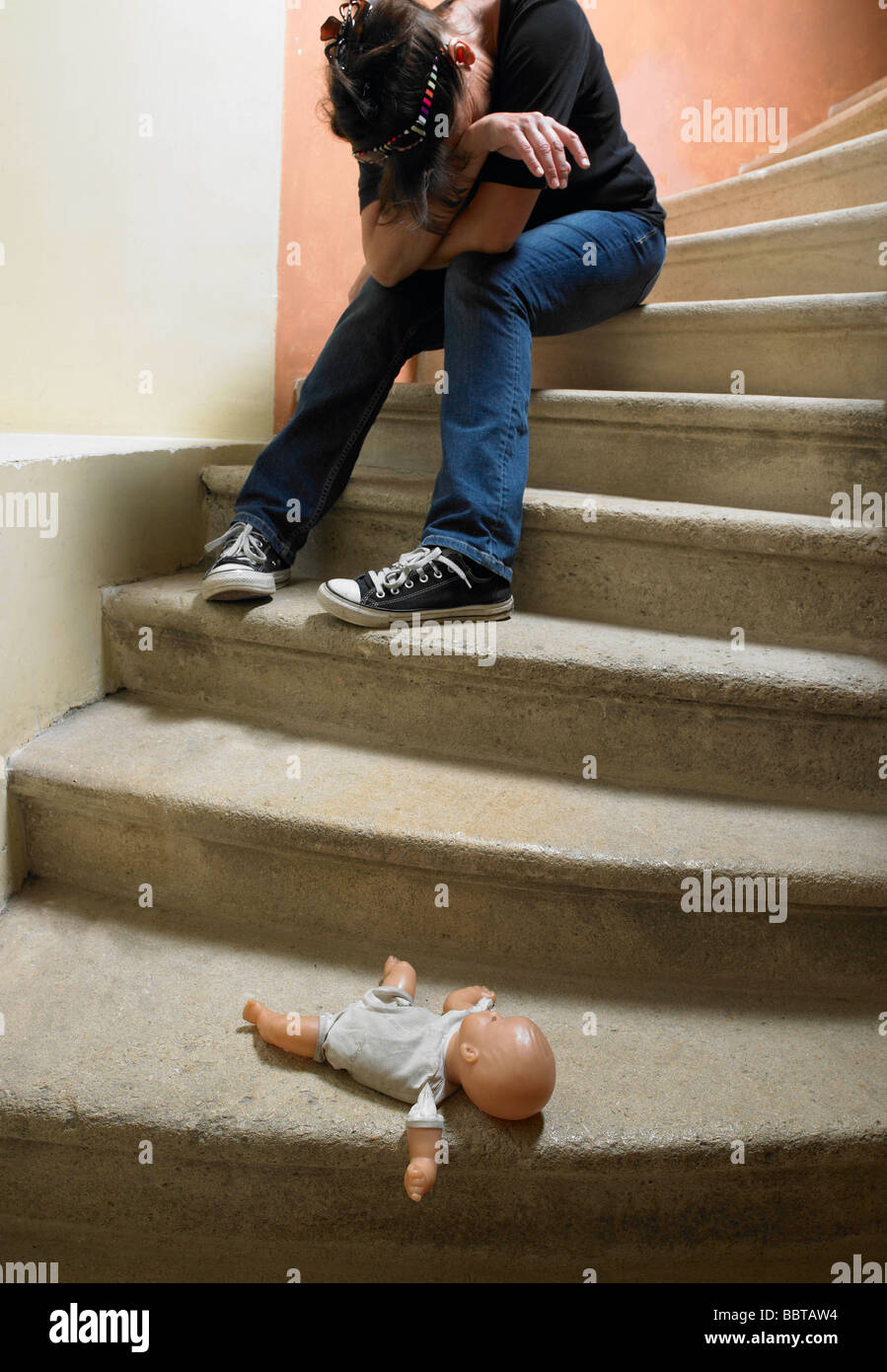 Woman crying stairs hi-res stock photography and images - Alamy