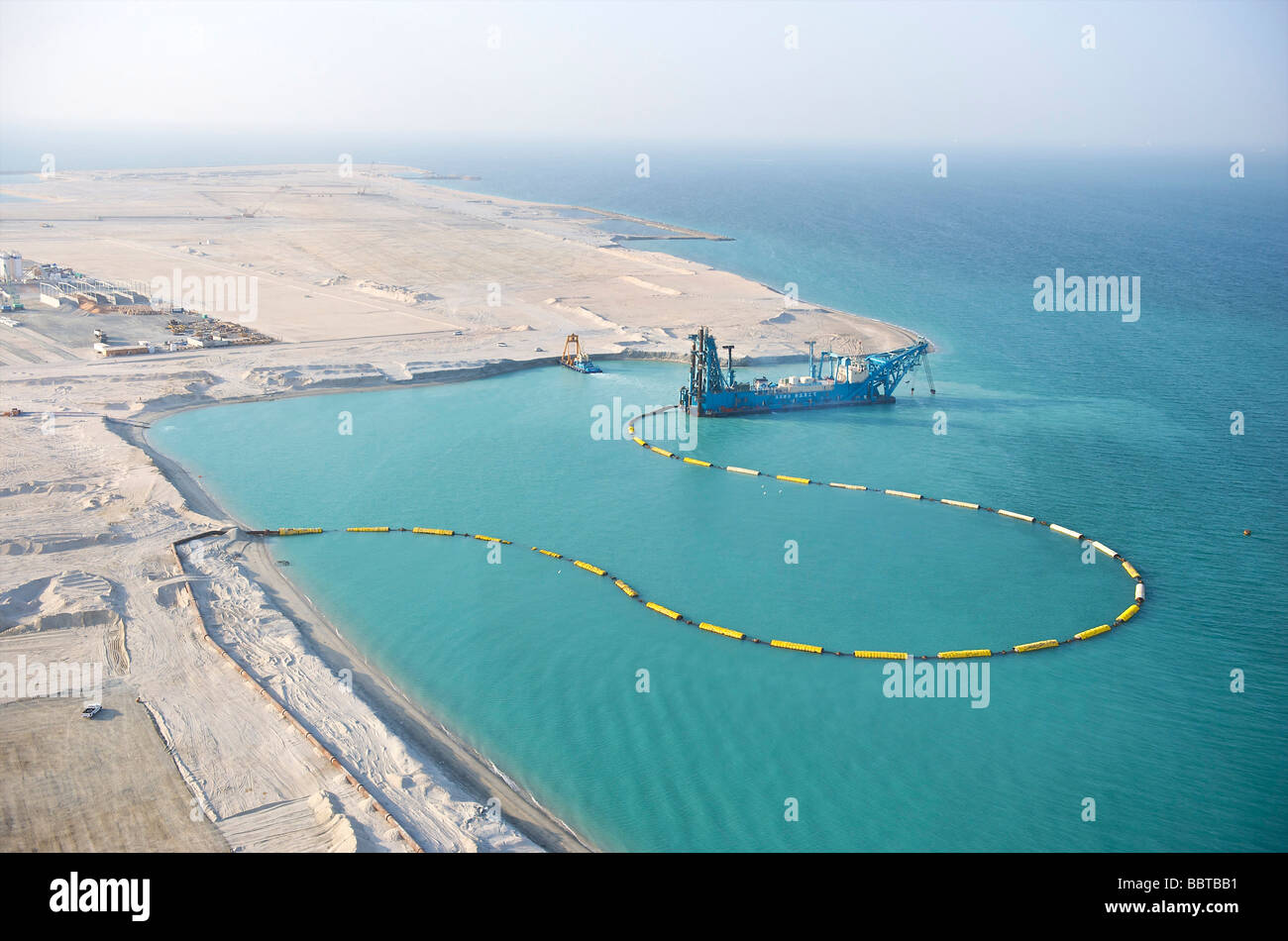 Dubai the World a dredge ship reclaiming land for the new harbour Stock ...