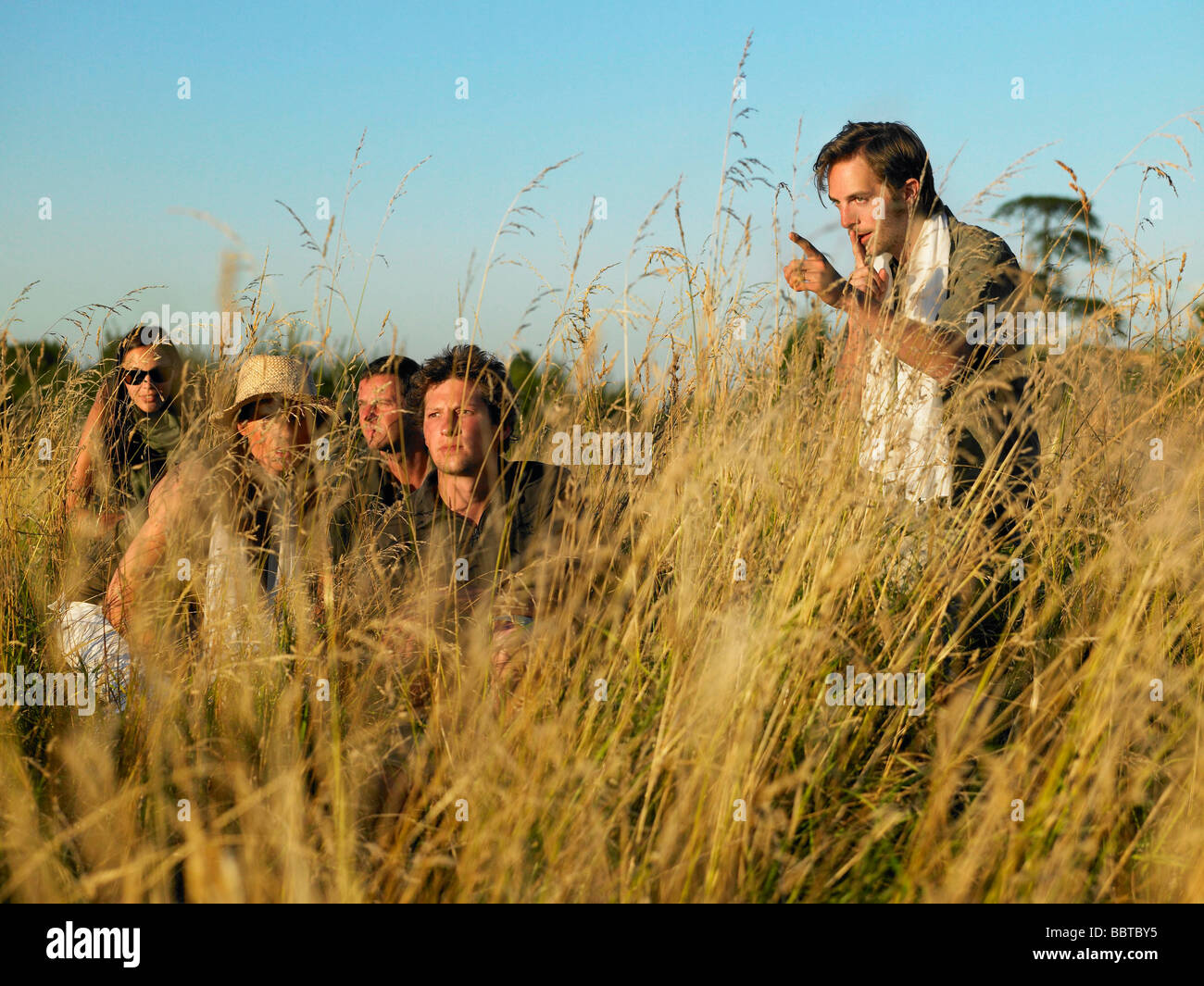 People in a safari with guide Stock Photo - Alamy