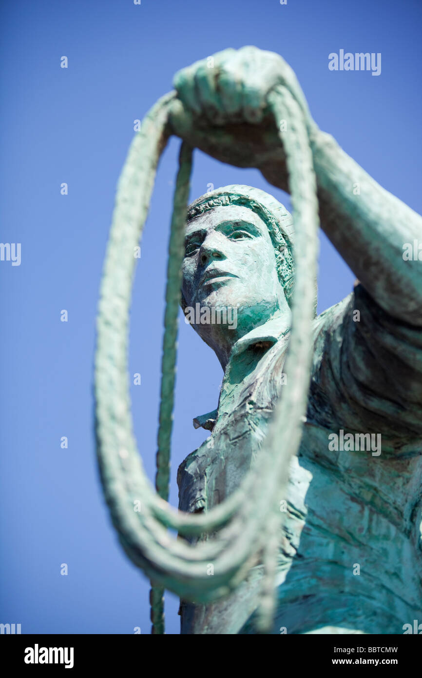 A statue of a young fisherman by local artist Tom Leaper in Newlyn is a ...