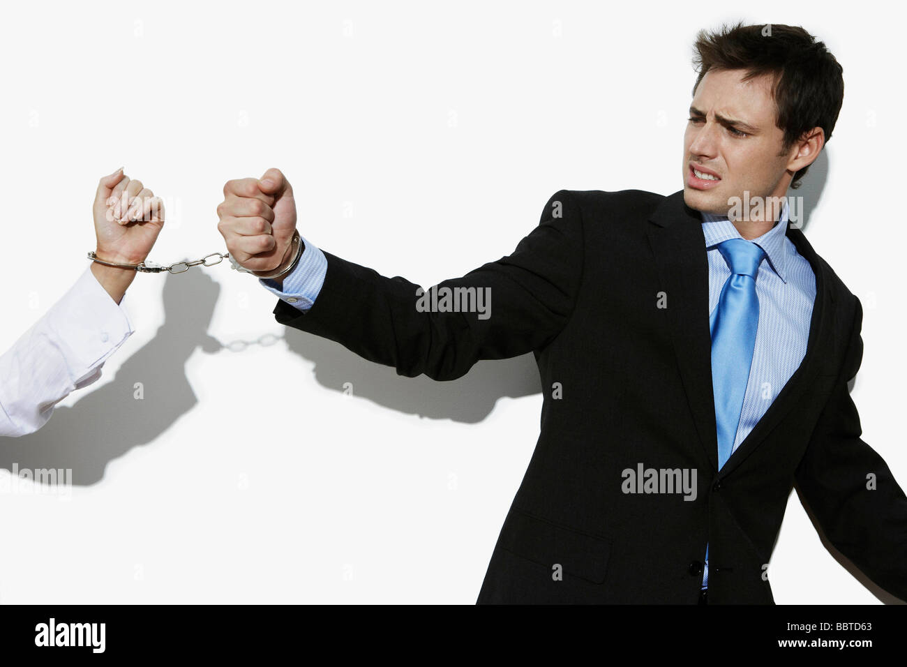 Handcuffed young man hi-res stock photography and images - Alamy