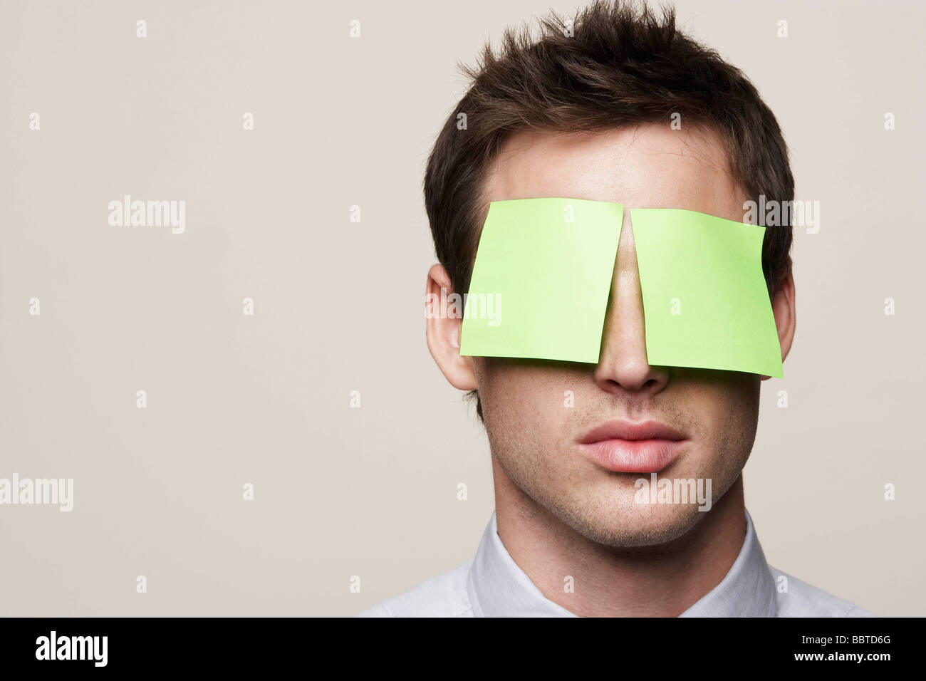 Business man with post-it notes on eyes Stock Photo - Alamy