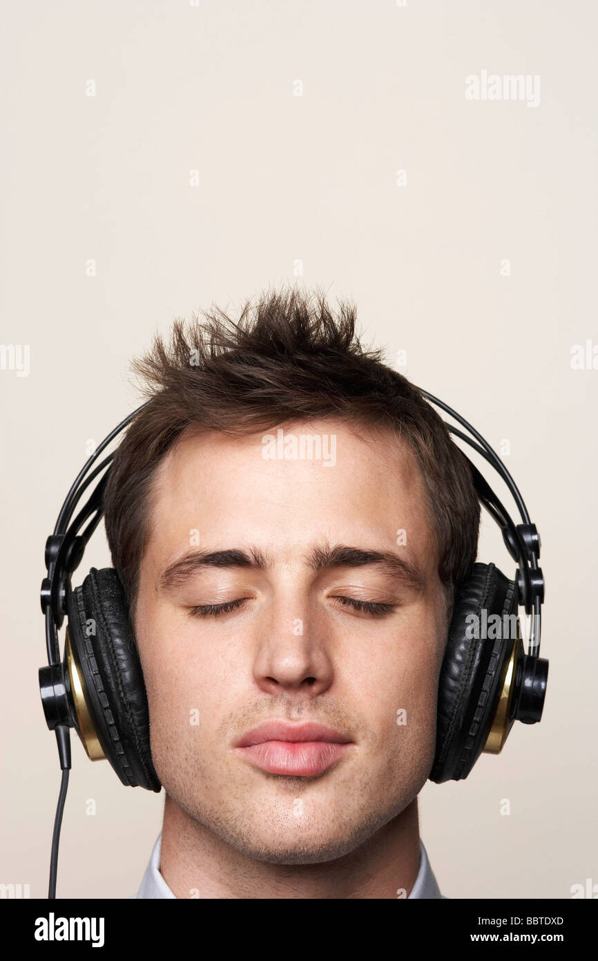 Young man wearing headphones Stock Photo - Alamy