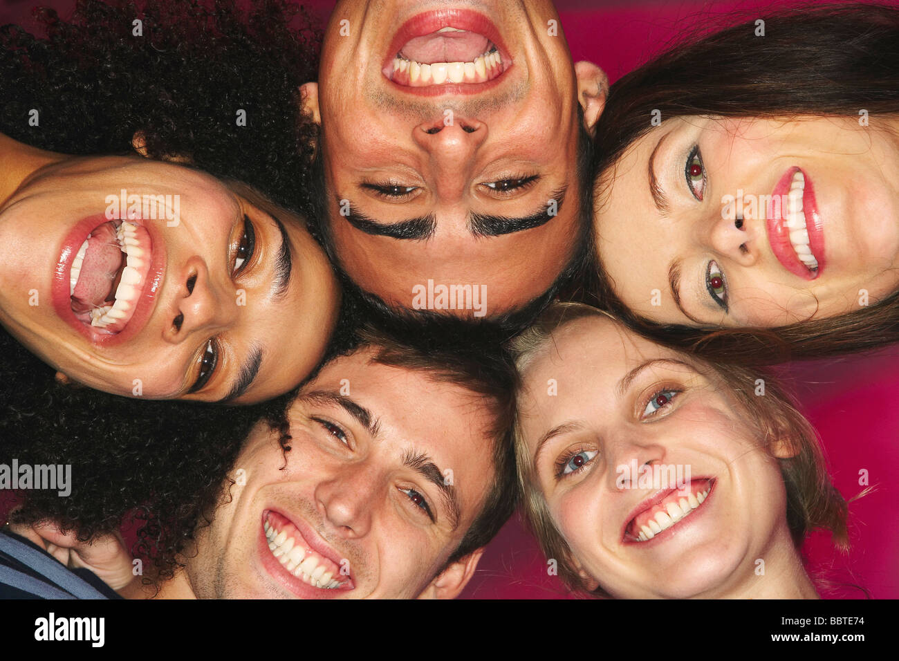 Young group of friends, heads together Stock Photo - Alamy